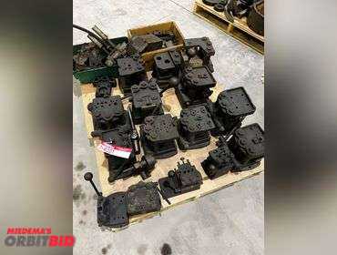 Orbitbid.com® | Pallet of pump fixtures on skid.