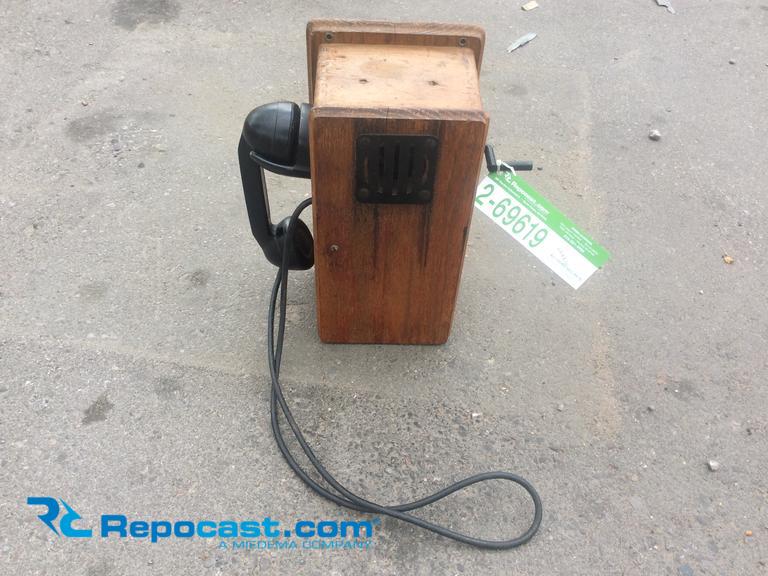 Repocast.com® | Vintage crank style phone in a wooden...