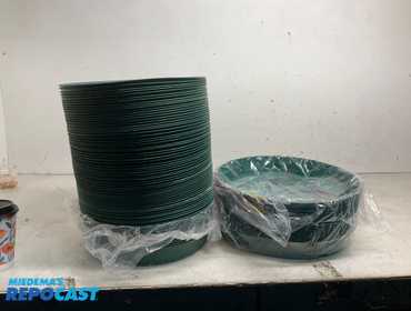 Repocast.com® | Stack of round plastic water catchers....