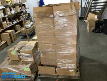 Repocast.com® | Skid of cardboard boxes with divider...