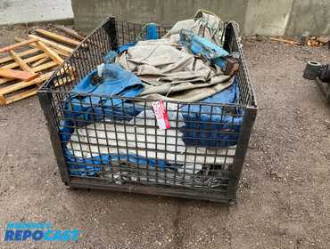 Repocast.com® | (1) metal crate full of assorted tarps...