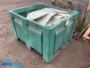 Repocast.com® | Forkable crate with a large white tarp...