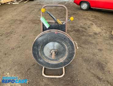 Repocast.com® | Portable pallet bander with hand strapper