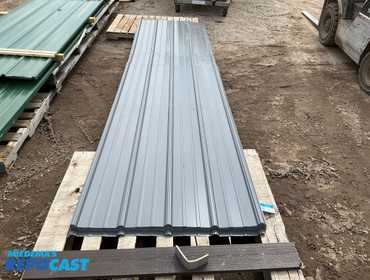 Repocast.com® | Stack of gray corrugated metal roofing...