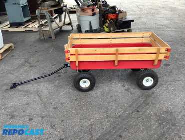 Repocast.com® | A Metal red wagon with a wood rail...