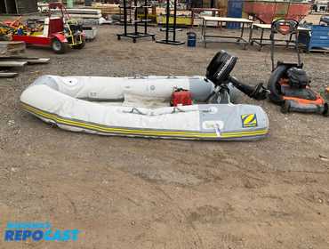 Repocast.com® | (1) Zodiac raft with a Mercury 5 HP...