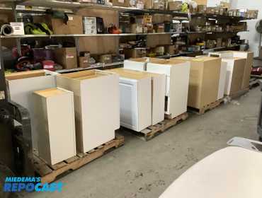 Repocast.com® | (4) Skids of white kitchen cabinet set...
