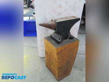 Repocast.com® | Large anvil on solid wood block. Anvil...