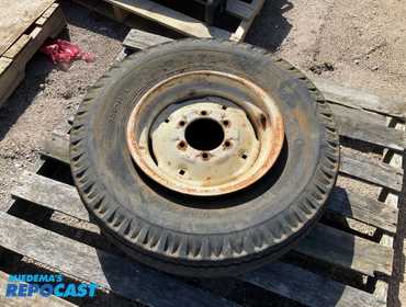 Repocast.com® | One Ford tractor front wheel and tire....
