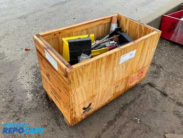 Repocast.com® | Wooden crate filled with miscellaneous...