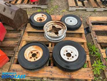 Repocast.com® | Pallet of five utility trailer wheels...
