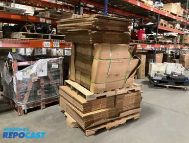 Repocast.com® | Skid of assorted sized shipping boxes.