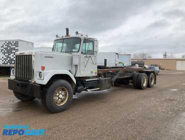 Repocast.com® | 1987 GMC M9500 Rolloff Truck...