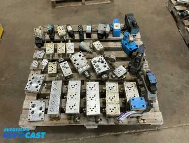 Repocast.com® | Skid of assorted industrial valve blocks