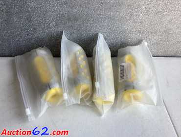 Auction62.com | Lot of (4) Yellow Chew Toys- New